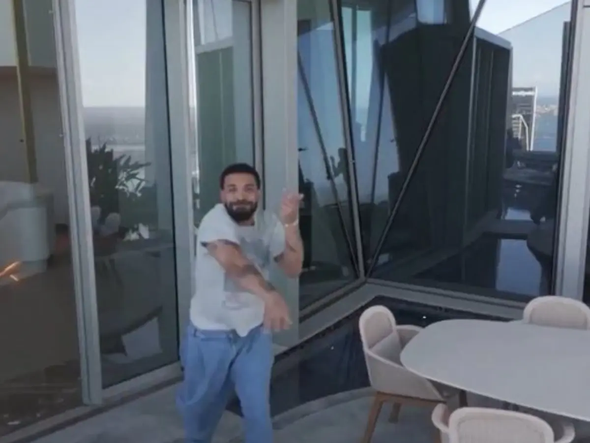 Drake aims his slipper at drone hovering around his apartment in viral ...